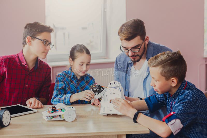 Stem Education. Kids Creating Robots with Teacher Stock Image - Image ... Stem Education. Kids Creating Robots with Teacher Stock Image - Image ...