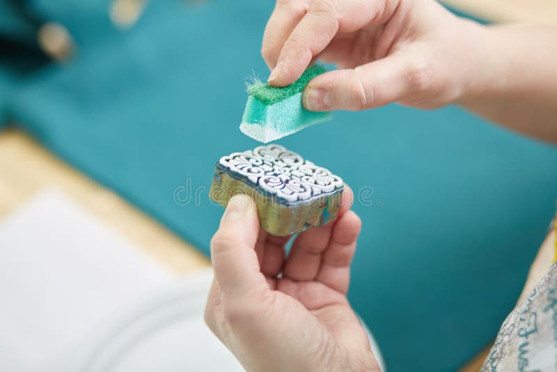 Step 2. Applying Fabric Paint To the Stamp Using a Sponge. Stock Image ...