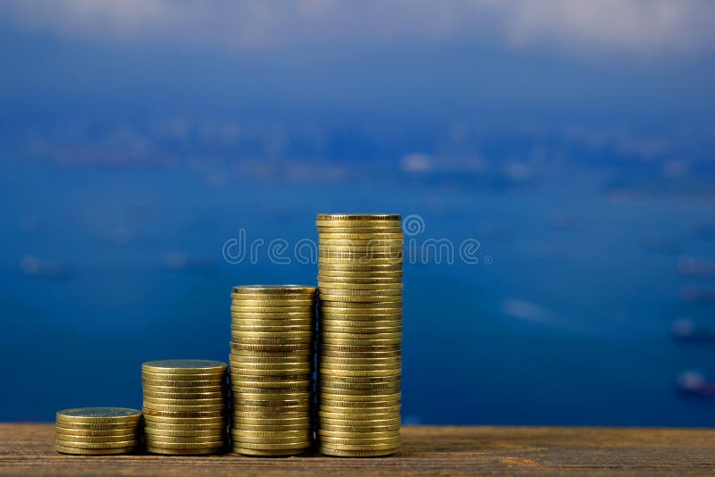Step of Coin Stack on Top Wooden Working Table Over Seascape and Stock ...