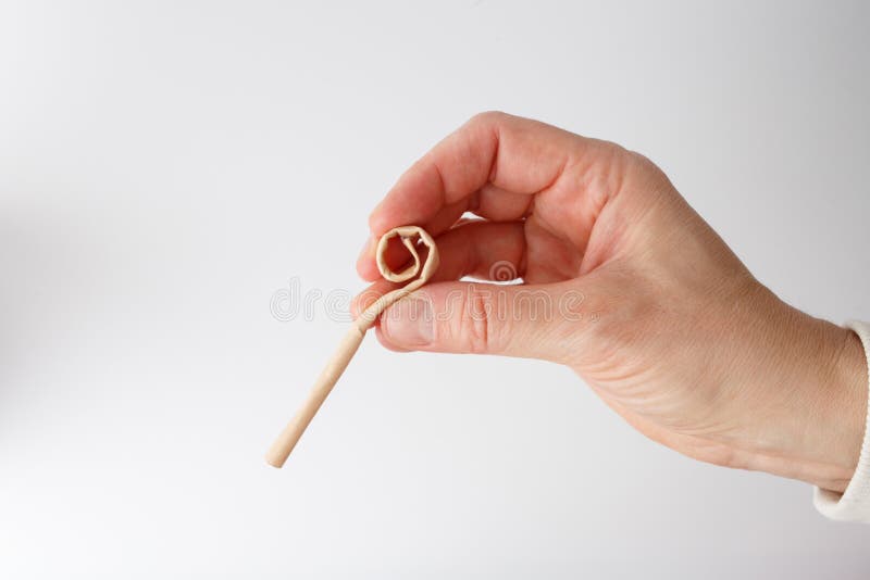 A Step in a Creative Craft Process. it Features a Hand Holding a ...