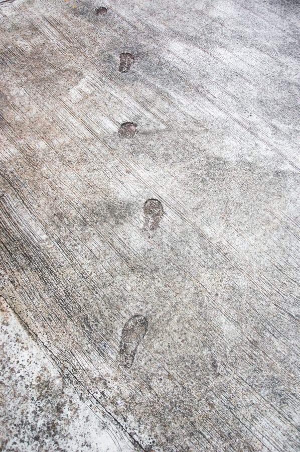 A Footprint in a Concrete Sidewalk Stock Image - Image of standing ...