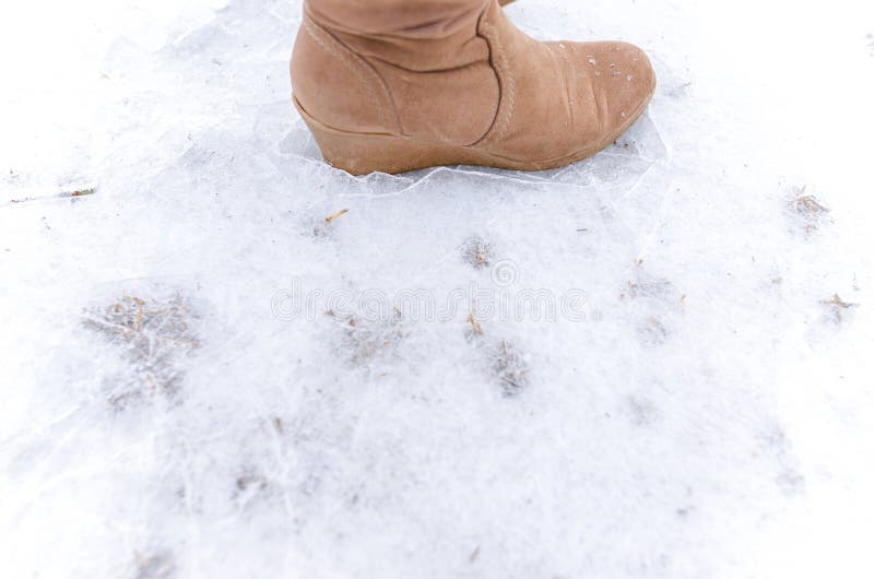 Step on frosted ground stock photo. Image of footwear - 98426900