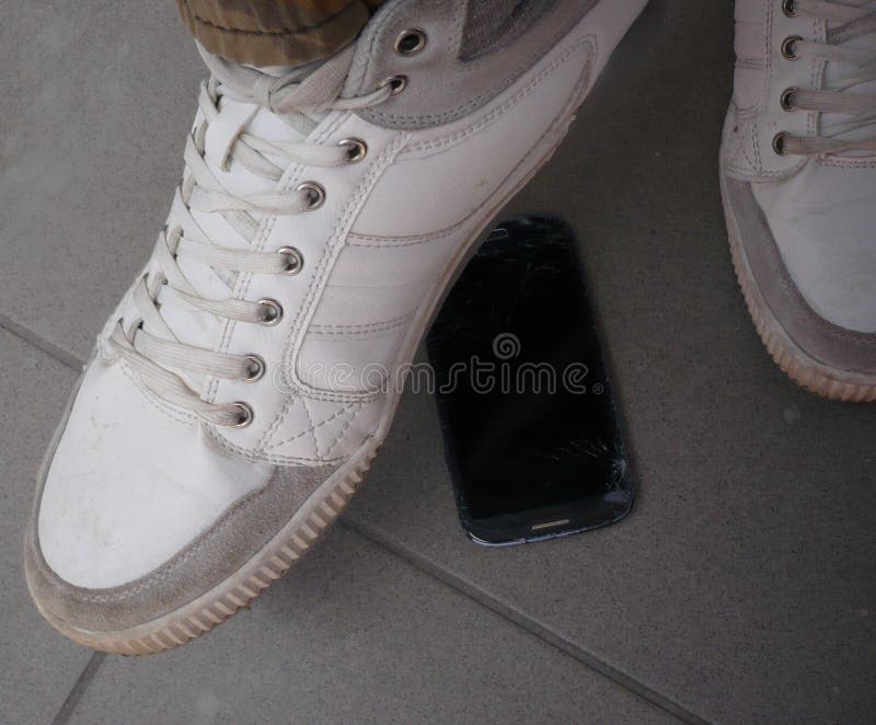 Step on the mobile phone stock image. Image of slam, sneakers - 49138393