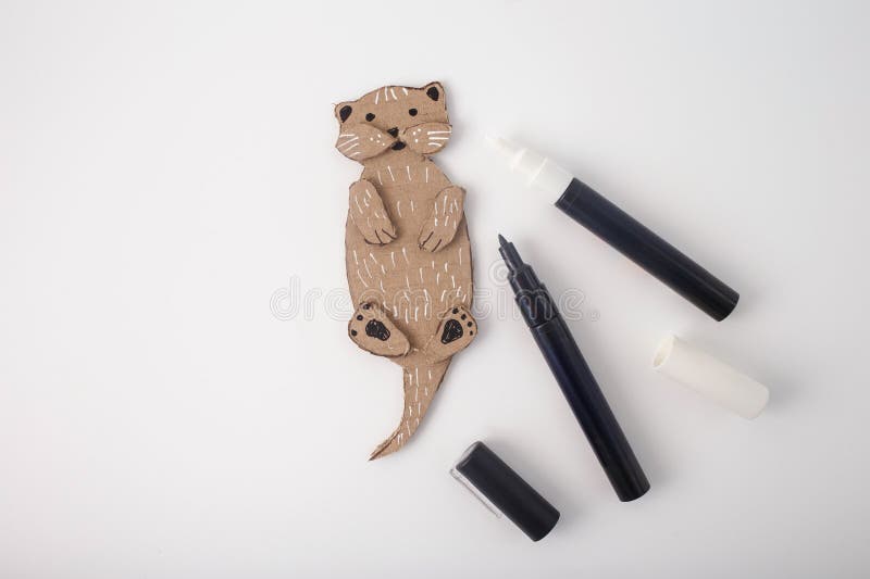 Step-by-step Process of Making an Otter-shaped Cardboard Craft ...