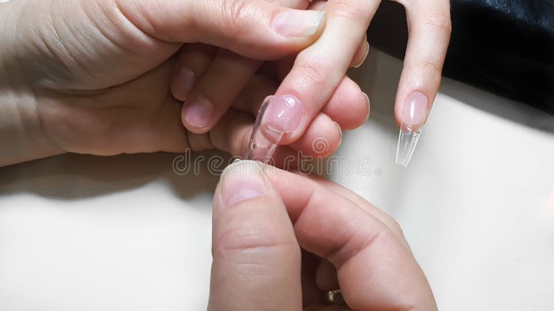 Step-by-step Instructions for Nail Extension on Gel Tips. Manicure, Hands in the Foreground ...