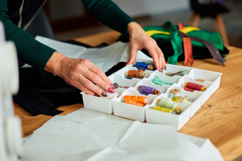Step by Step, Woman`s Dressmaker Hand Pulls the Thread Out of the Box ...