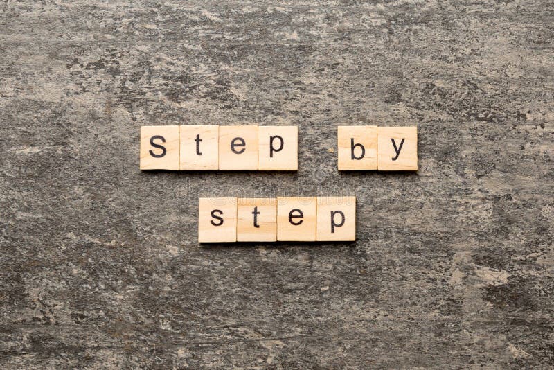 Step by Step Word Written on Wood Block. Step by Step Text on Table ...