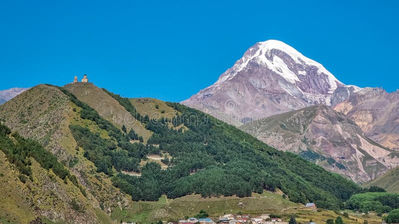 Stepantsminda - Distant View on Gergeti Trinity Church in Stepansminda ...