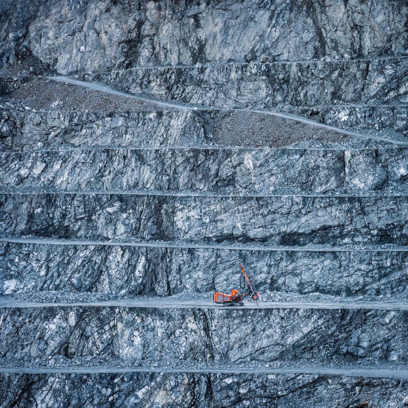 Drilling Machine on a Bench of Diabase Quarry in Misty Morning Stock ...