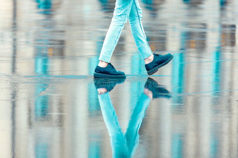 Stepping Reflection on the Wet Pavement Stock Photo - Image of ...