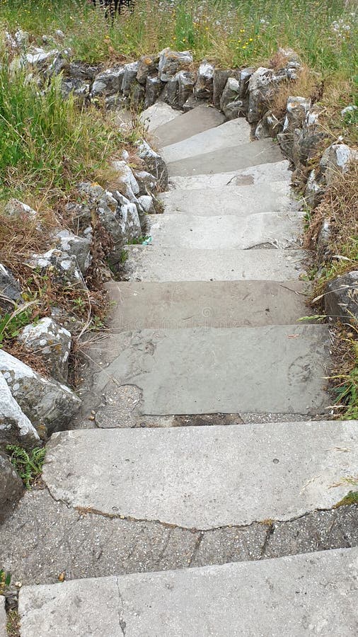 Stepping on a rock stock image. Image of walkway, stonewall - 231714075