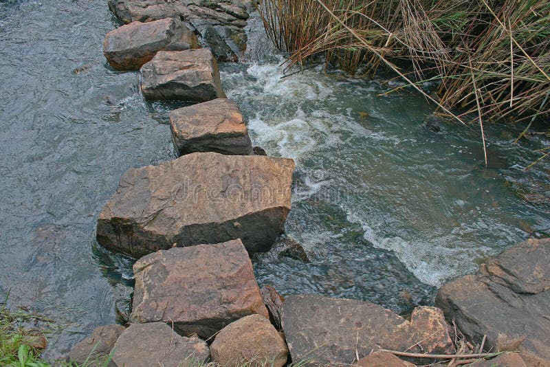 Stepping Stones Across Flowing Water Stock Photo - Image of river ...
