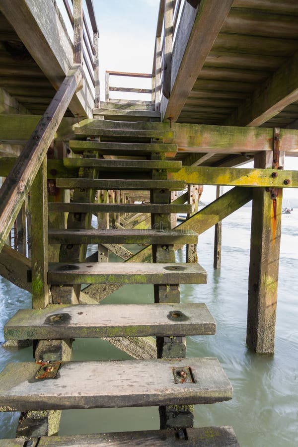 Steps beneath jetty stock photo. Image of seaside, maritime - 77161042