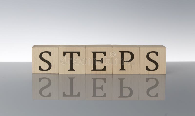 STEPS Word on the Wood Blocks Concept with Chart, Coins, Notebook and ...