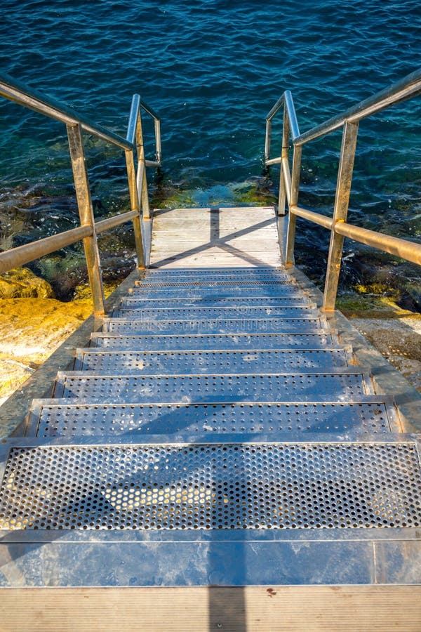 Steps leading into the sea stock photo. Image of urban - 129409556