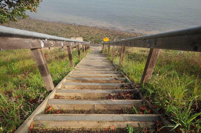 Steps with Railings Lead Down To a Beach Stock Photo - Image of water ...
