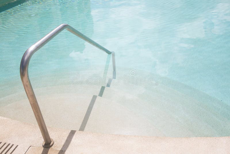 Steps into swimming pool stock image. Image of hold - 252924025