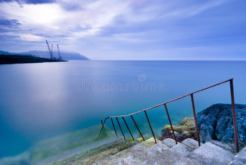 Steps to water stock image. Image of clouds, railings - 25106801