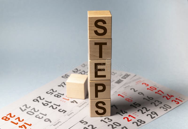 STEPS Word on Cube Blocks on Calendar Sheets on Office Table Stock ...