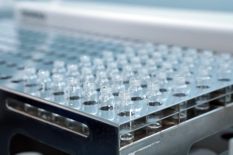 Sterile Capsules for Injection. Bottles on the Bottling Line of the ...