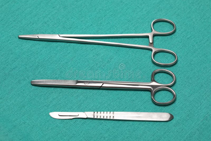 Sterile Instruments on a Green Background Close-up. Preparing ...
