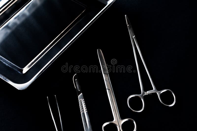 Sterile Instruments on a Green Background Close-up. Preparing ...
