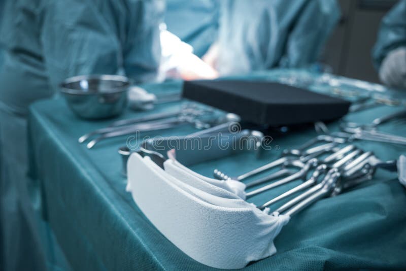 Some Sterile Surgical Instruments are on a Table during an Operation ...