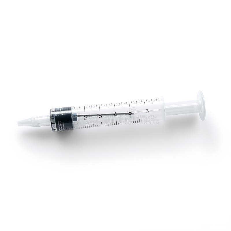 A Sterile Syringe with a Capped Needle Lying Flat on a White Surface ...