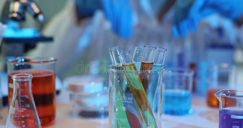 Sterile Table with Laboratory Glassware Filled with Liquid Stock ...