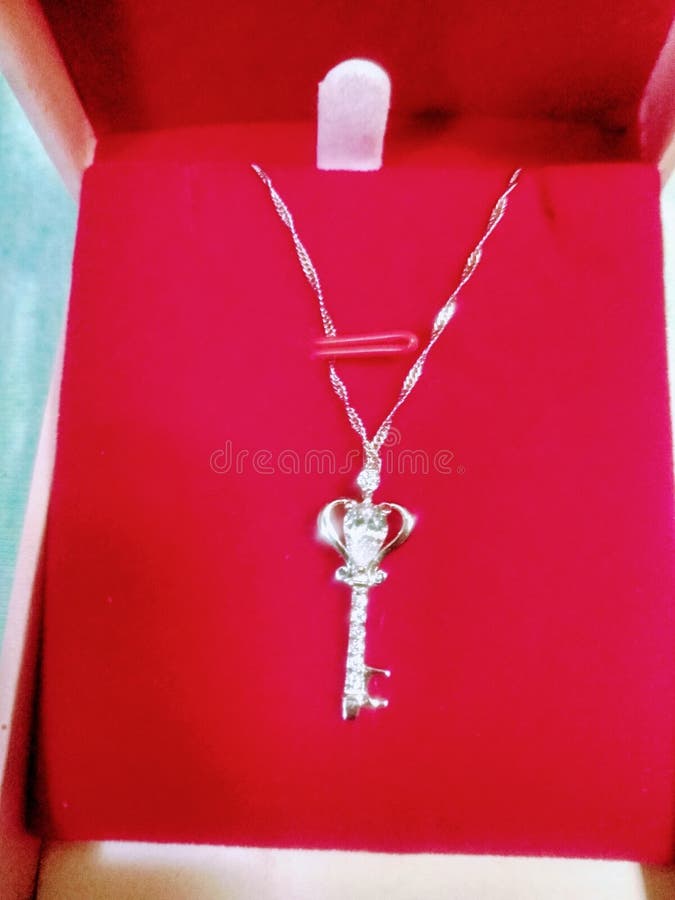 Sterling Silver Key Pendent with Authentic Diamond Necklace Stock Photo ...