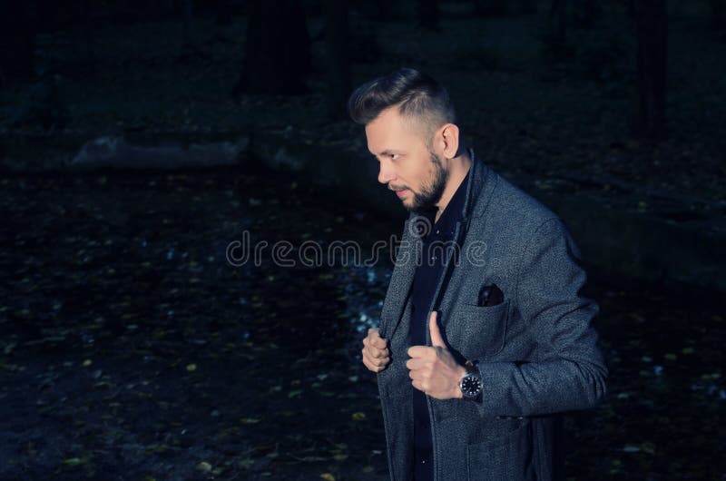 Stern Bearded Man in an Aggressive Pose with His Hands on Lapels Stock ...