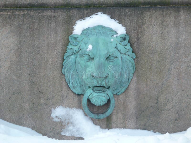 Stern Face of a Bronze Lion Stock Photo - Image of historical, snow ...