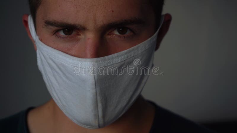 Stern Man in a Mask Looking at the Camera Stock Footage - Video of ...