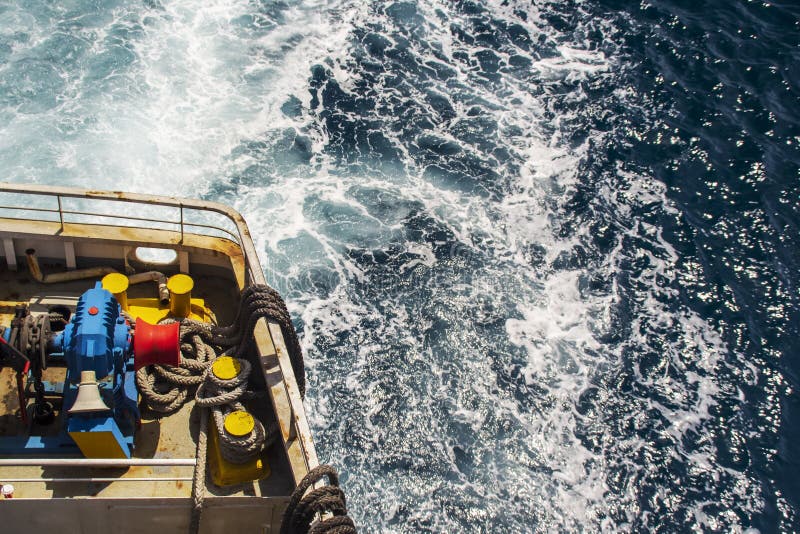 Stern Wave of a Motor Boat with the Motor in Foreground and the Rocky ...