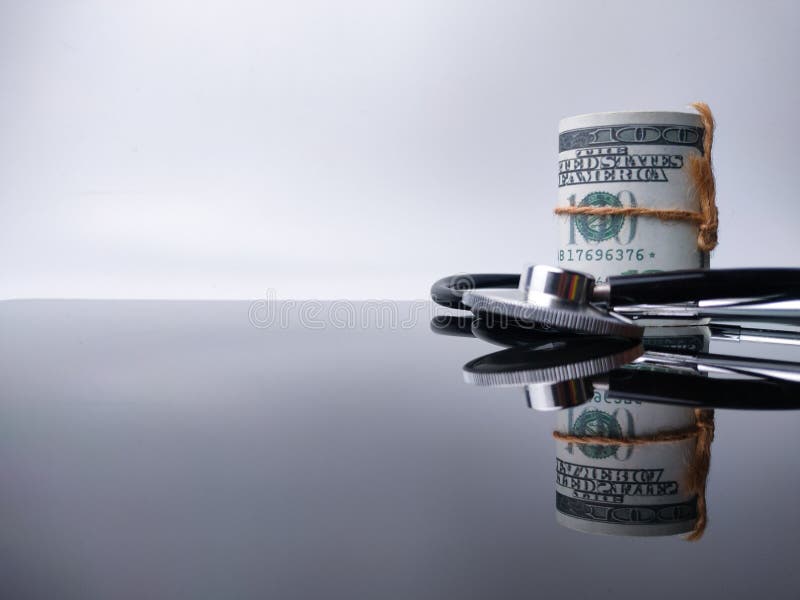 Stethoscope and Banknote with Reflection on a Black Acrylic Board Stock ...