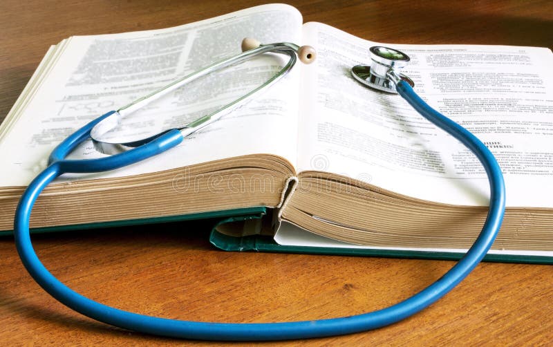 Stethoscope, Book, on a Desktop Stock Image - Image of attributes, book ...
