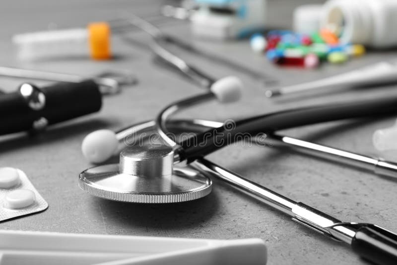 Stethoscope and Different Medical Objects on Grey Table Stock Image ...