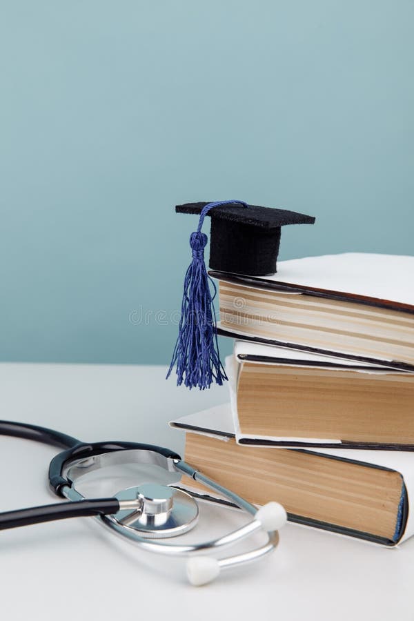 Stethoscope and Graduation Cap on Stack of Books. Medical Education ...