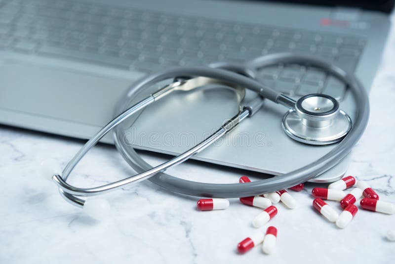 Stethoscope on Laptop with Capsules of Medicine Stock Image - Image of ...