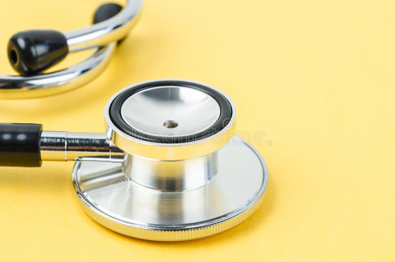 A Stethoscope Medical on Yellow Color Background Stock Photo - Image of ...