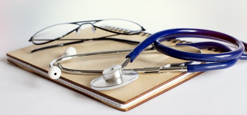 STETHOSCOPE on Notepad with Glasses , Medical Technology Concept Stock ...