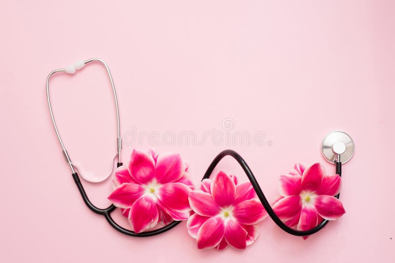 Stethoscope, Spring Flowers and Blue Easter Egg on Pink Background with ...