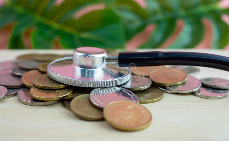 A Stethoscope Placed on a Pile of Money is a Financial Exam Concept ...