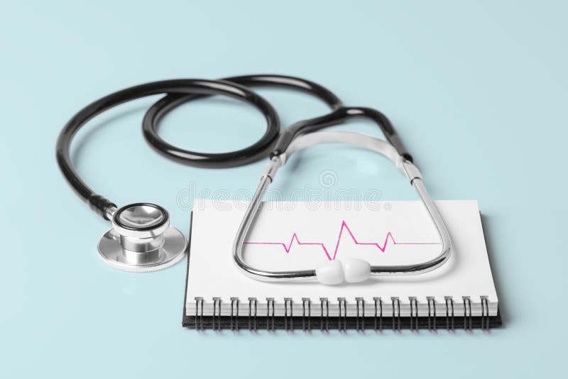 Stethoscope and Pulse Heartbeat Notebook Still Life Object on Blue ...