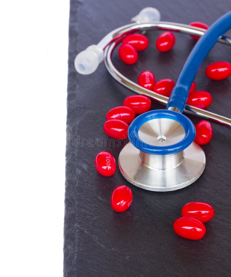 Stethoscope with red pills stock image. Image of healthcare - 43272283