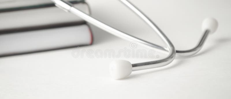 Stethoscope on Stack of Medical Guide Book for Doctor Learning ...