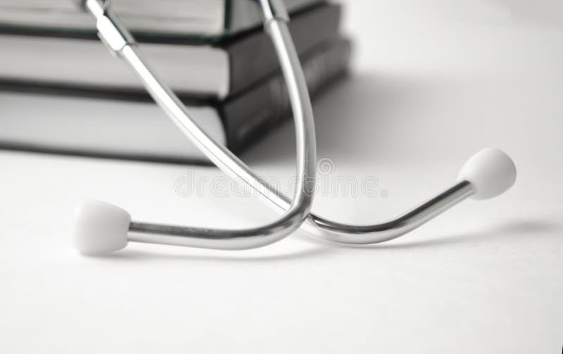 Stethoscope on Stack of Medical Guide Book for Doctor Learning ...