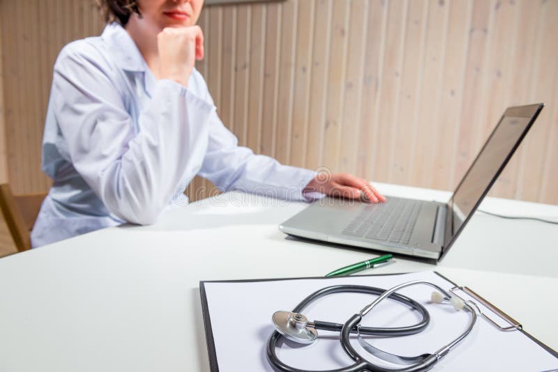 Stethoscope on a Table in Focus, Doctor Out of Focus Stock Photo ...
