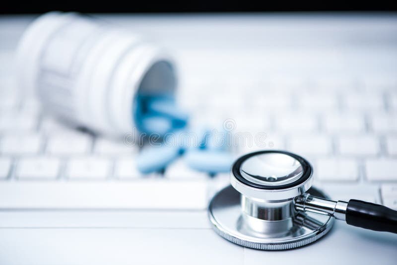 Stetoscope and Blue Pills on Keyboard Stock Photo - Image of check ...