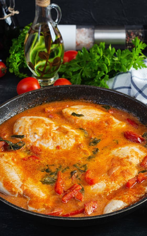 Stew Chicken Breast with Tomato, Pepper and Spinach in Pan Stock Photo ...